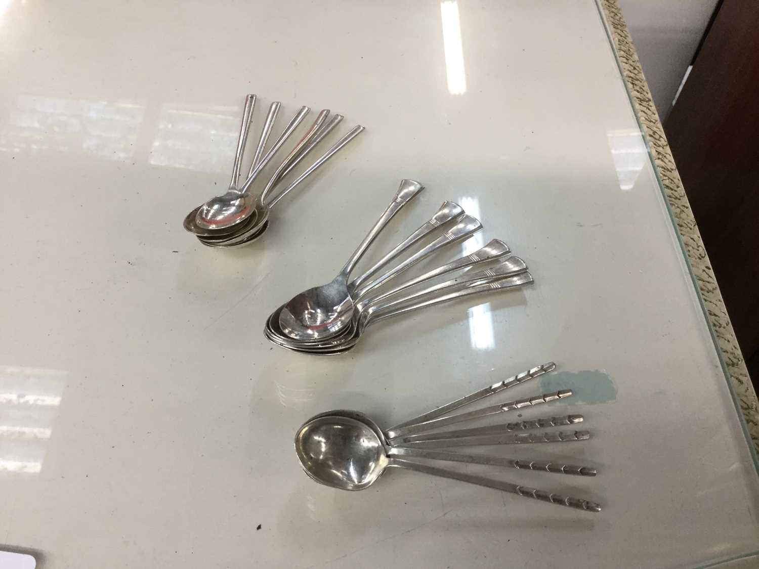 Lot 708 - Three sets of 6 silver coffee spoons, (18