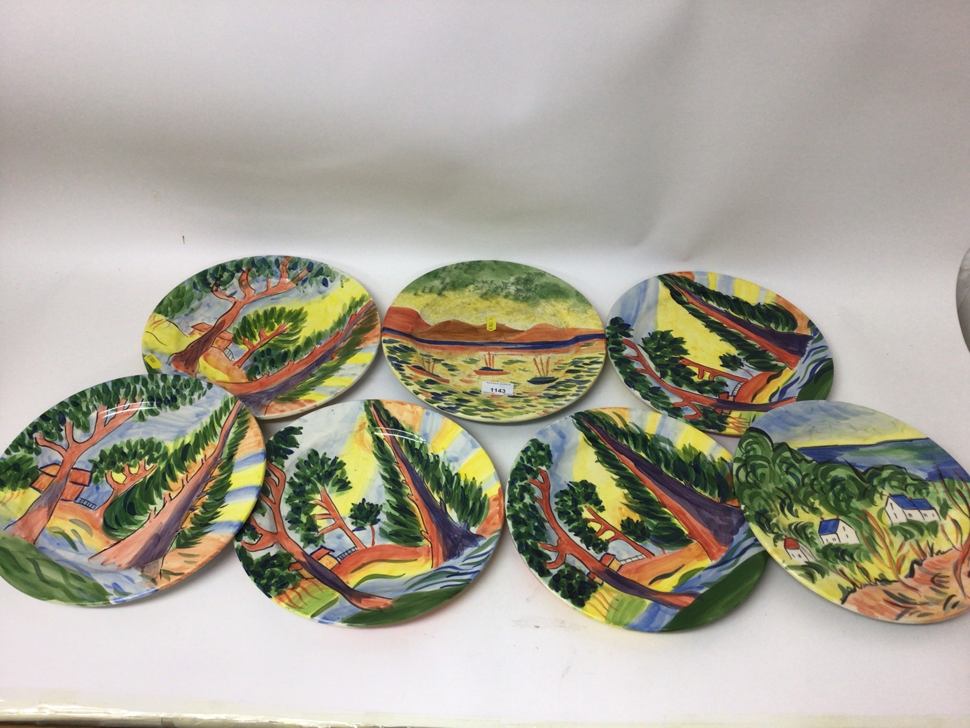 Lot 1143 - Seven studio pottery plates by Suzanne
