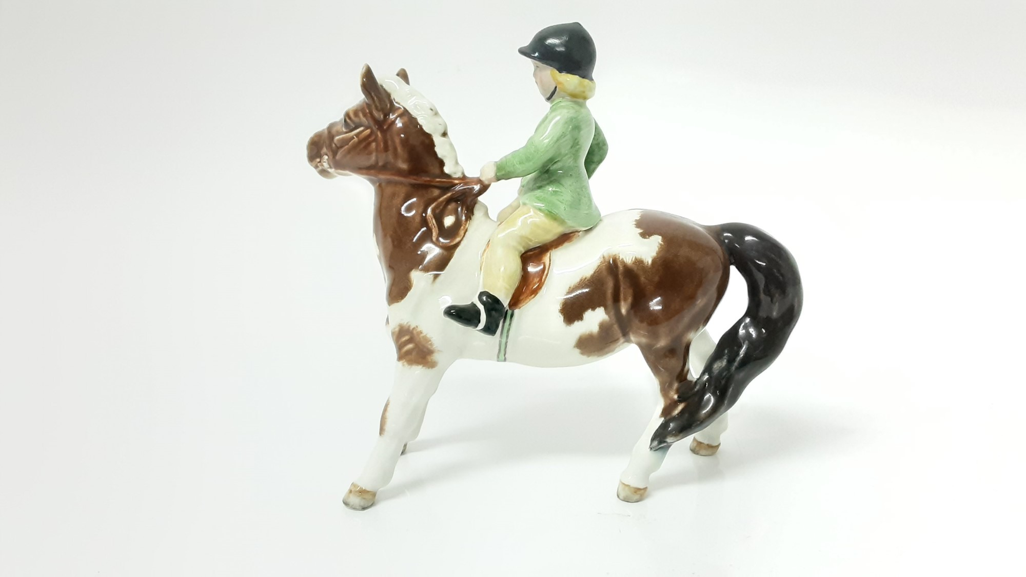 Lot 14 - Beswick Girl on Pony, model no. 1499,