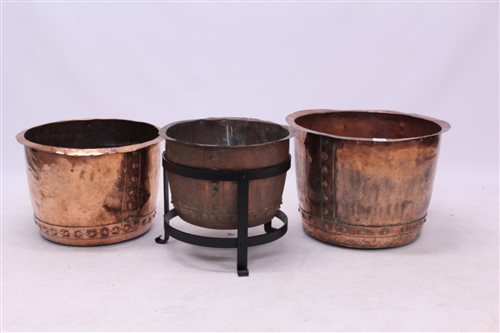 Lot 1455 - Three graduated rivetted copper vessels,