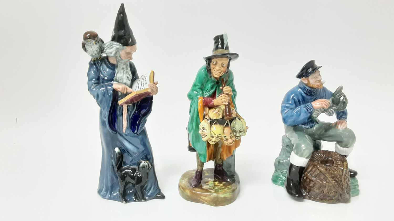 Lot 1324 - Three Royal Doulton figures: The Wizard HN