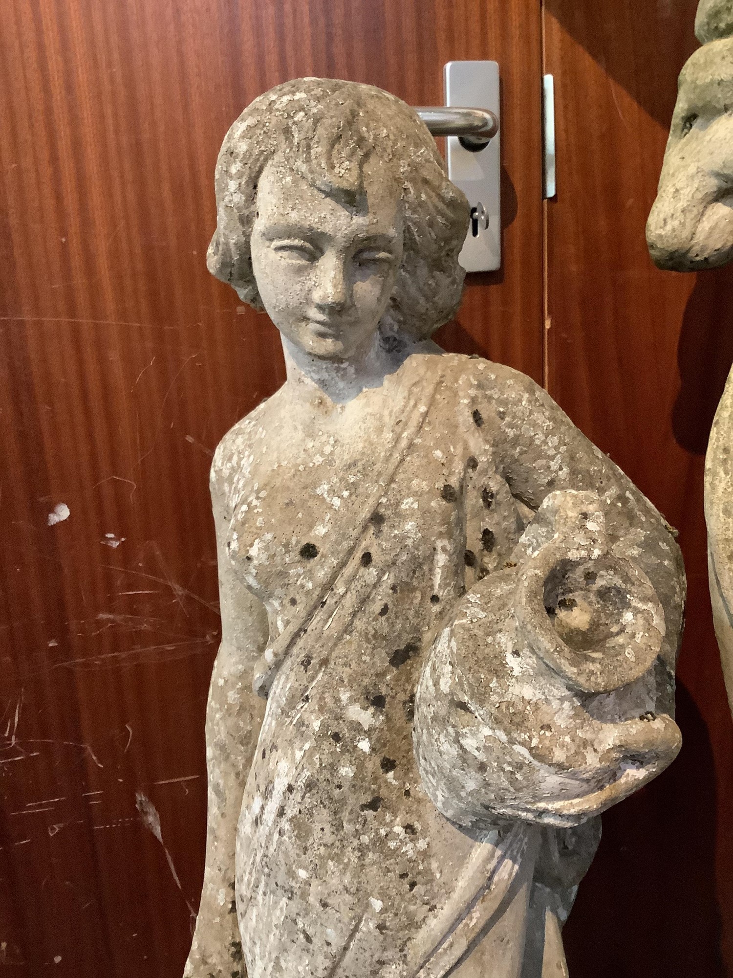 Lot 1040 - Concrete garden statue of a female with two