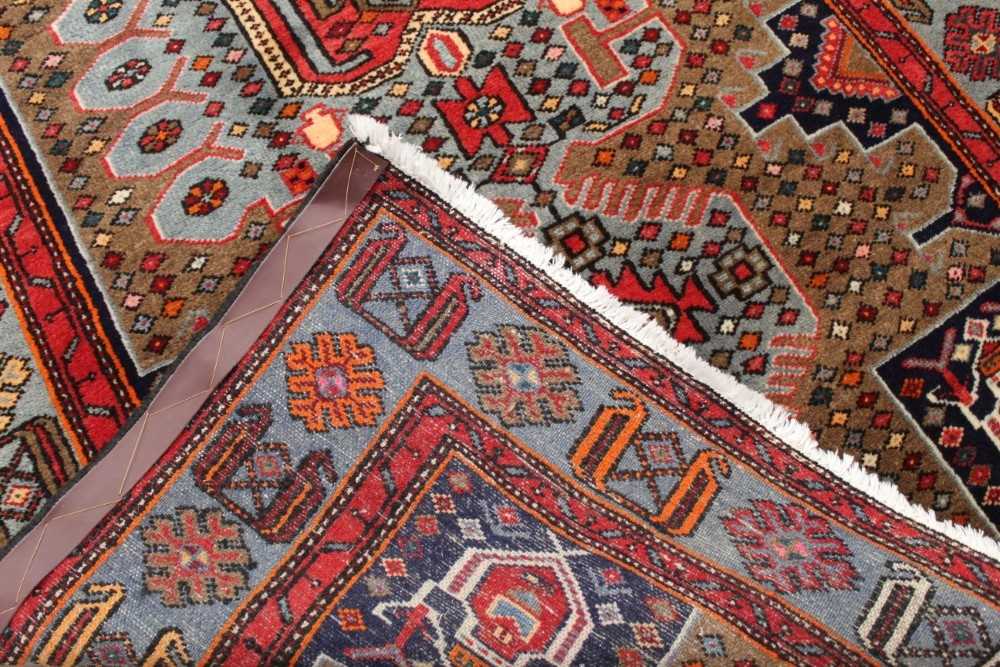 Lot 1526 - Persian design rug, with central conjoined