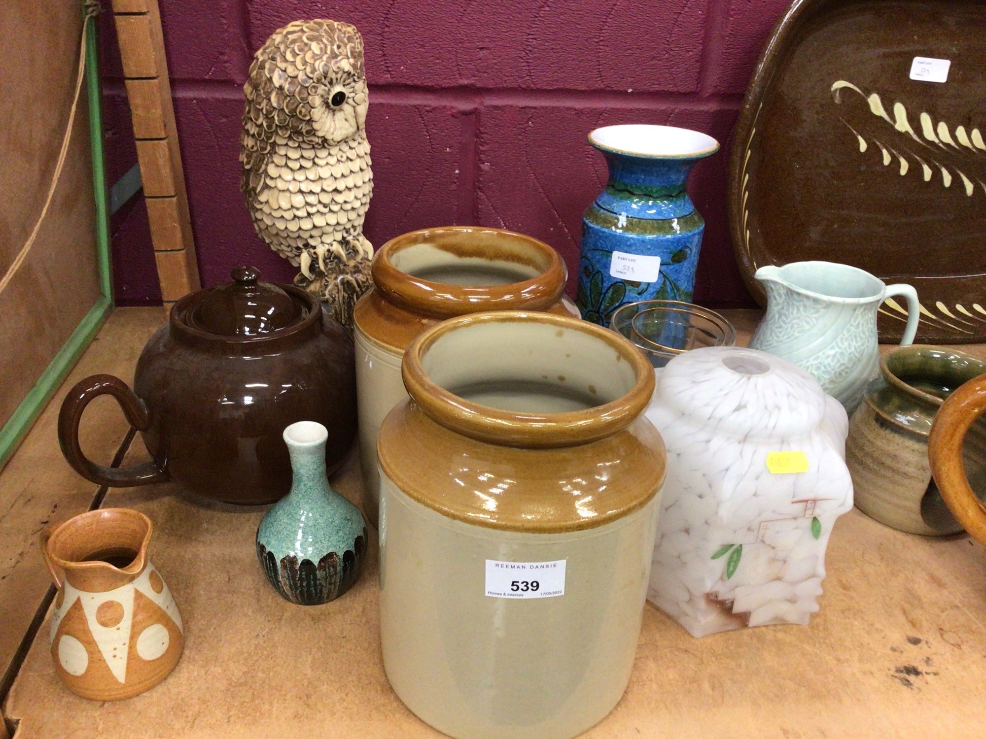 Lot 539 - Slip ware dish, salt glazed storage jars,