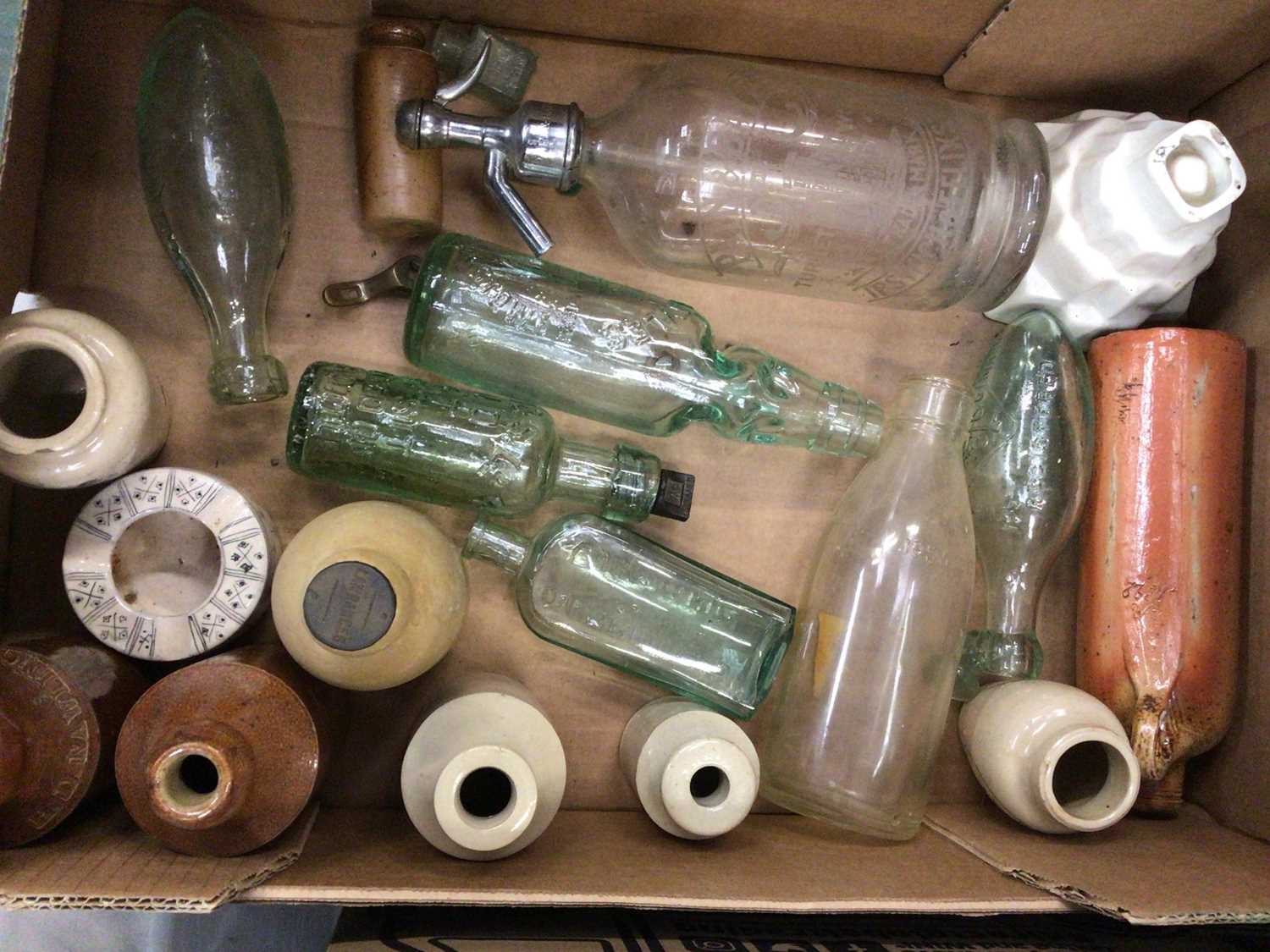 Lot 440 - Slip ware dishes, antique glass bottles,