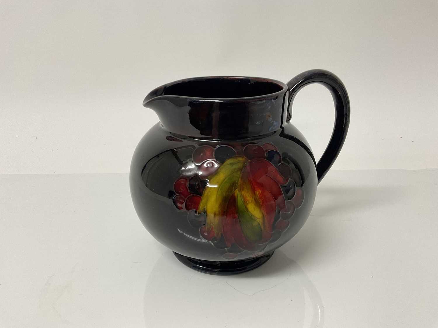 Lot 1106 - Moorcroft pottery Flambe jug decorated in