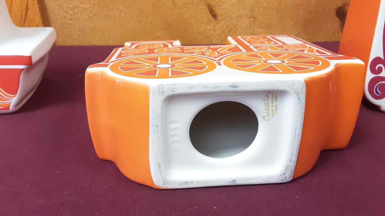 Lot 1158 - Three Carlton ware novelty money boxes