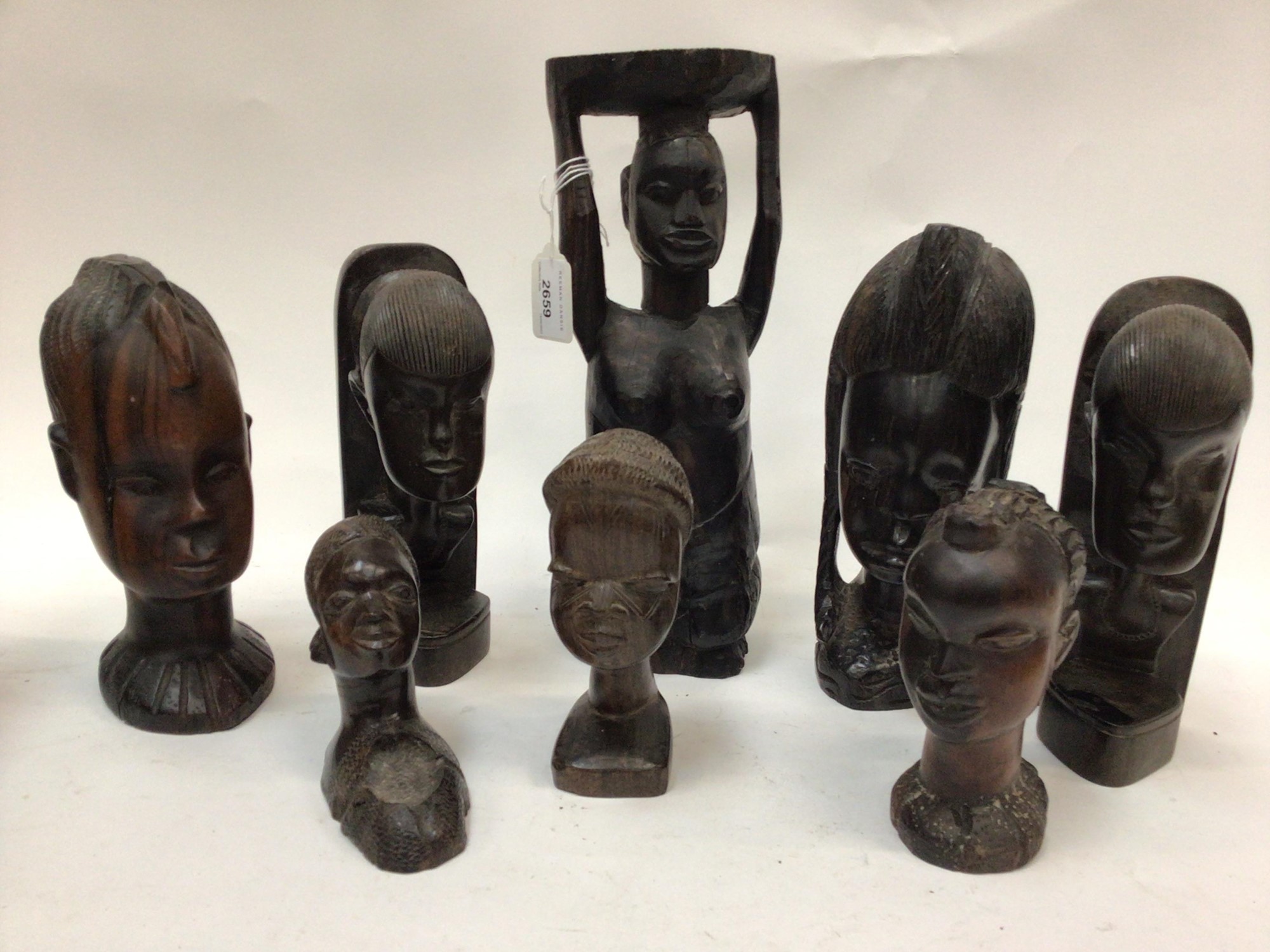 Lot 2659 - Group of carved African figures, masks,