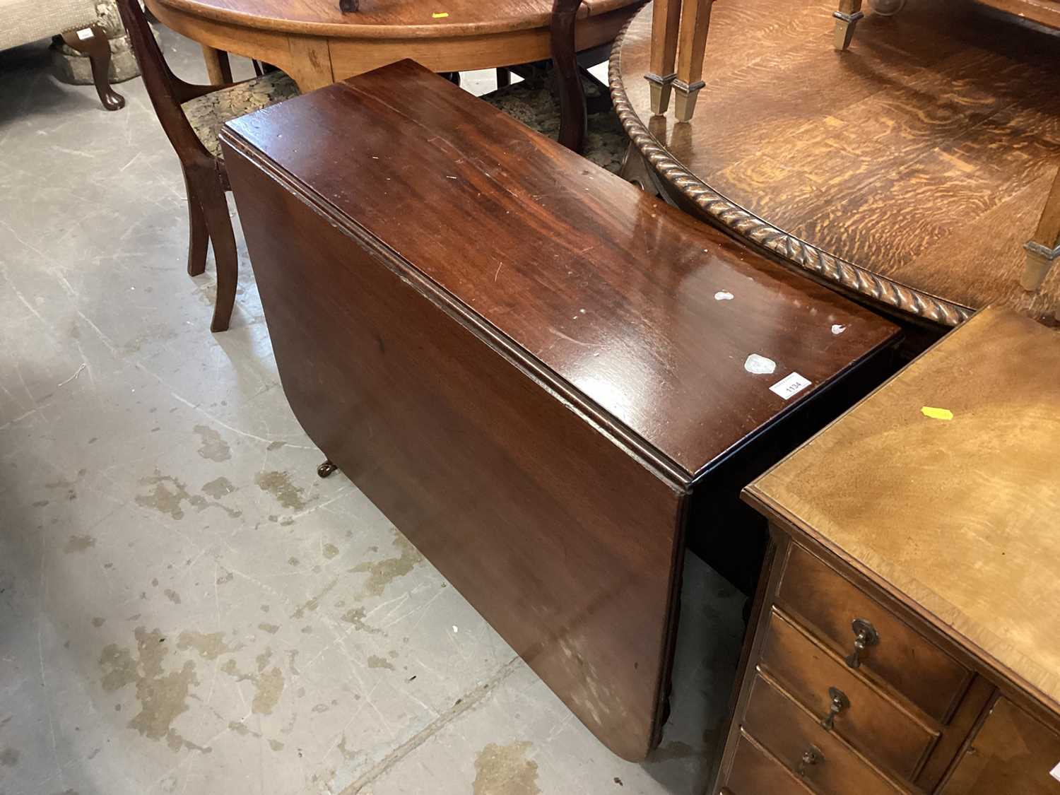 Lot 1134 - 19th century mahogany drop-flap dining