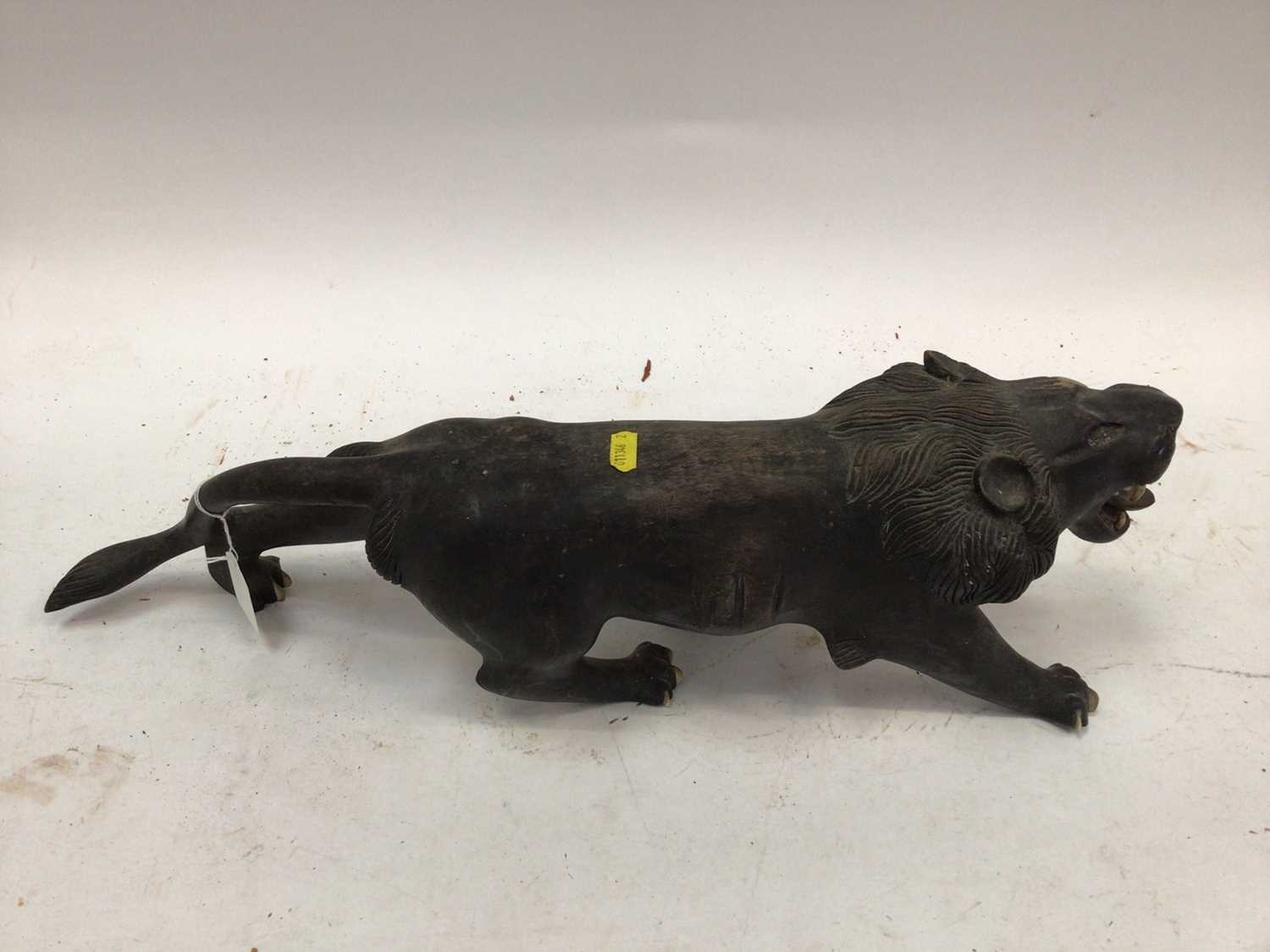 Lot 2552 - Eastern ebony carving of a lion
