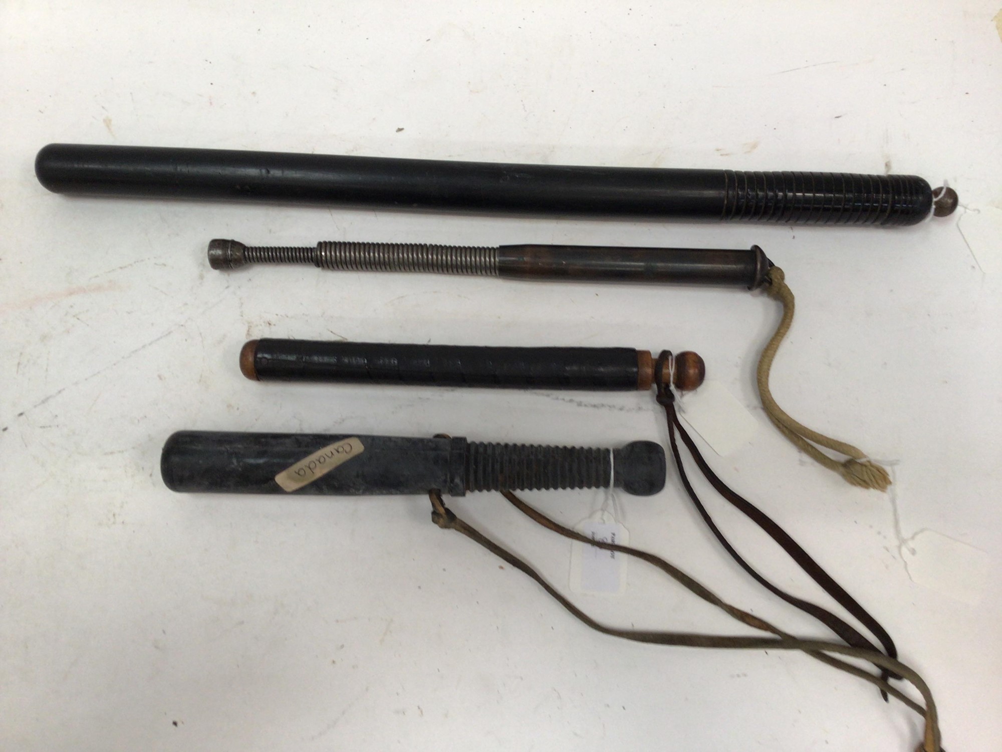 Lot 811 - Old Telescopic steel truncheon and three