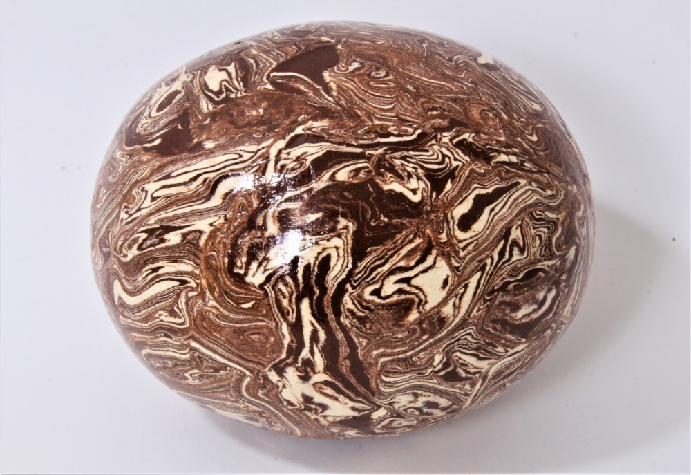 Lot 189 - Unusual agate ware pottery oval ball
