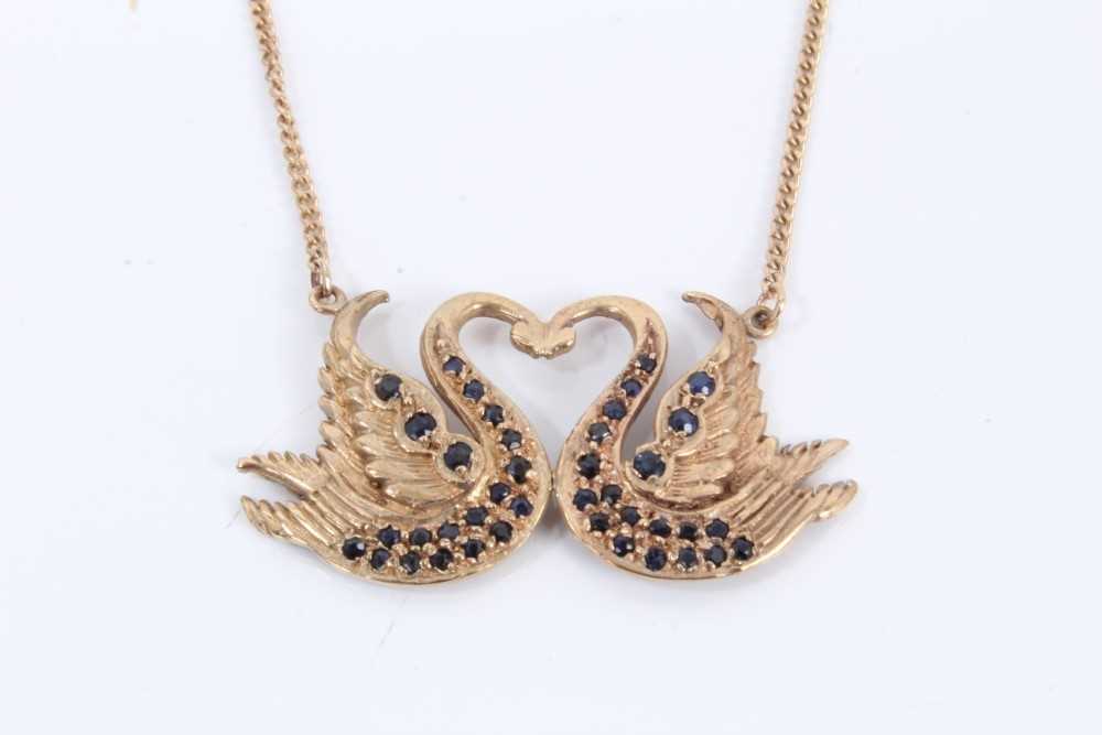 Lot 485 - 9ct gold and sapphire swan pendant necklace