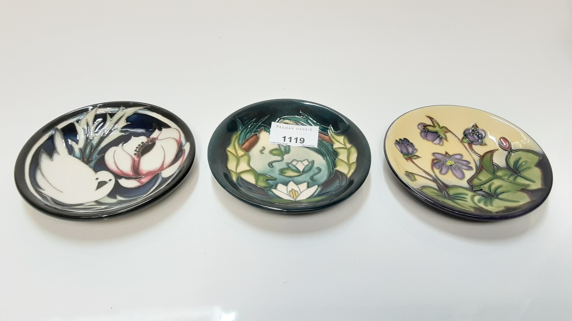 Lot 1119 - Three Moorcroft coasters/pin dishes to