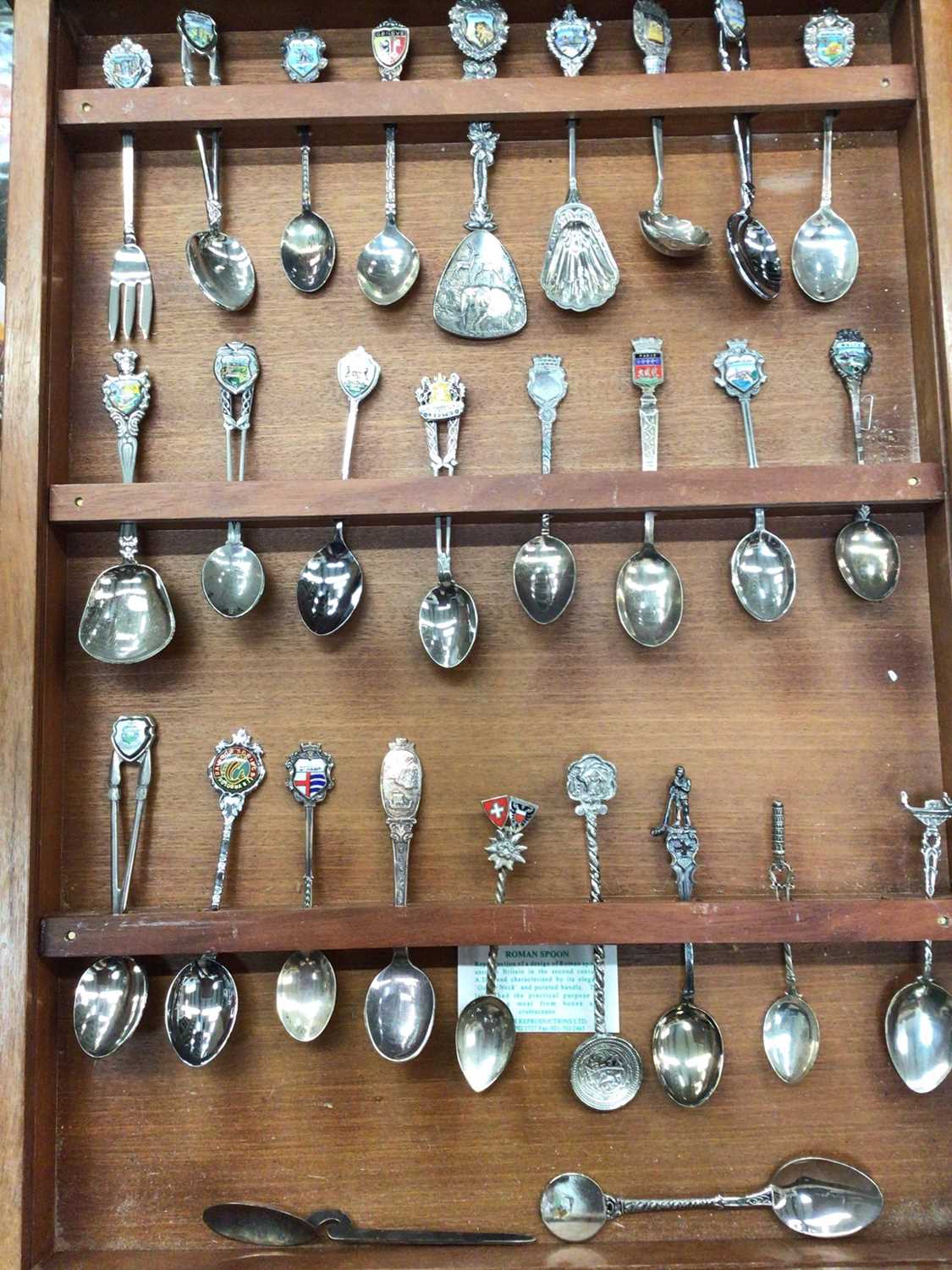 Lot 1102 - Collection of souvenir spoons in display
