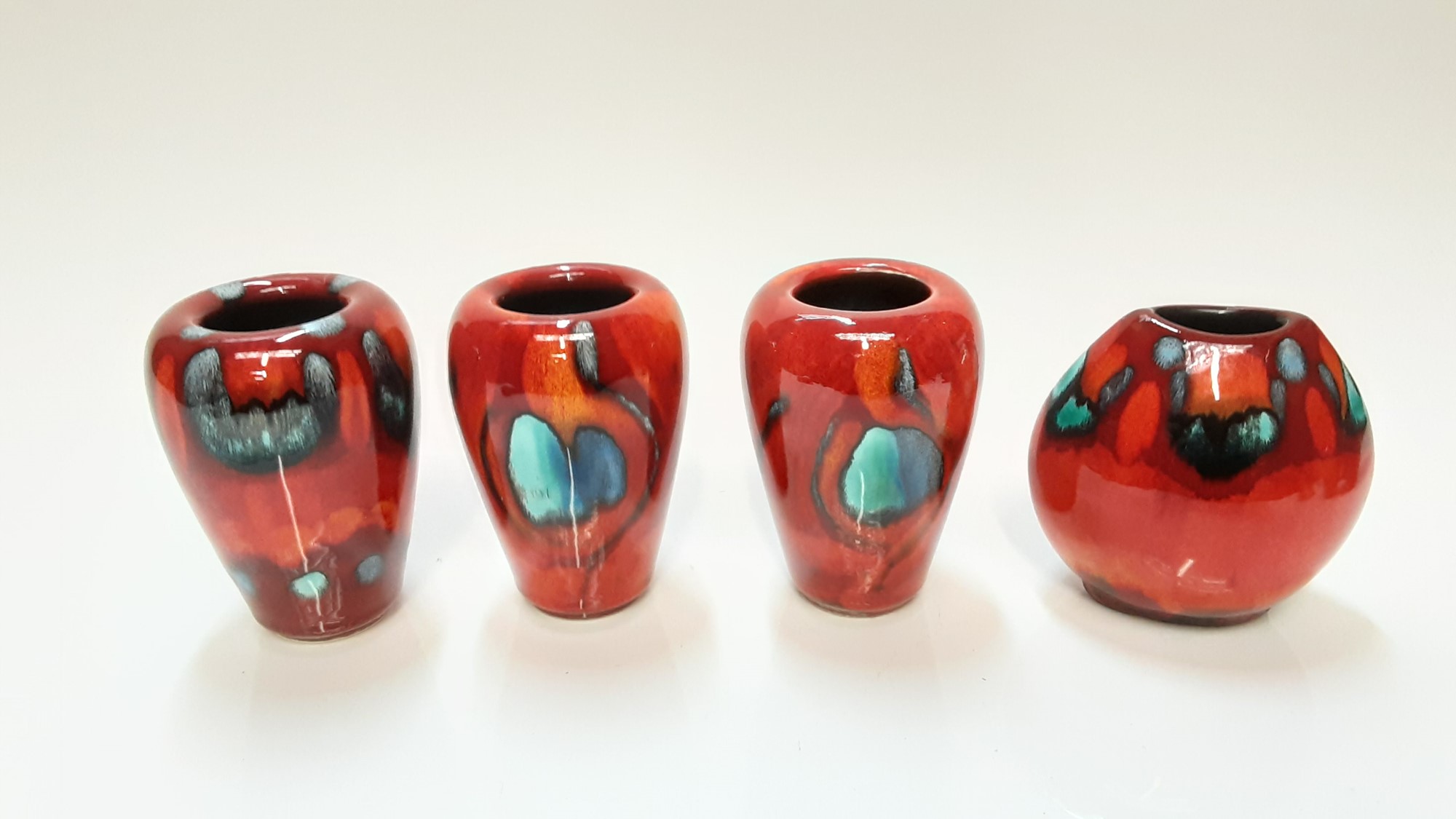 Lot 1219 - Eight various small Poole pottery vases and