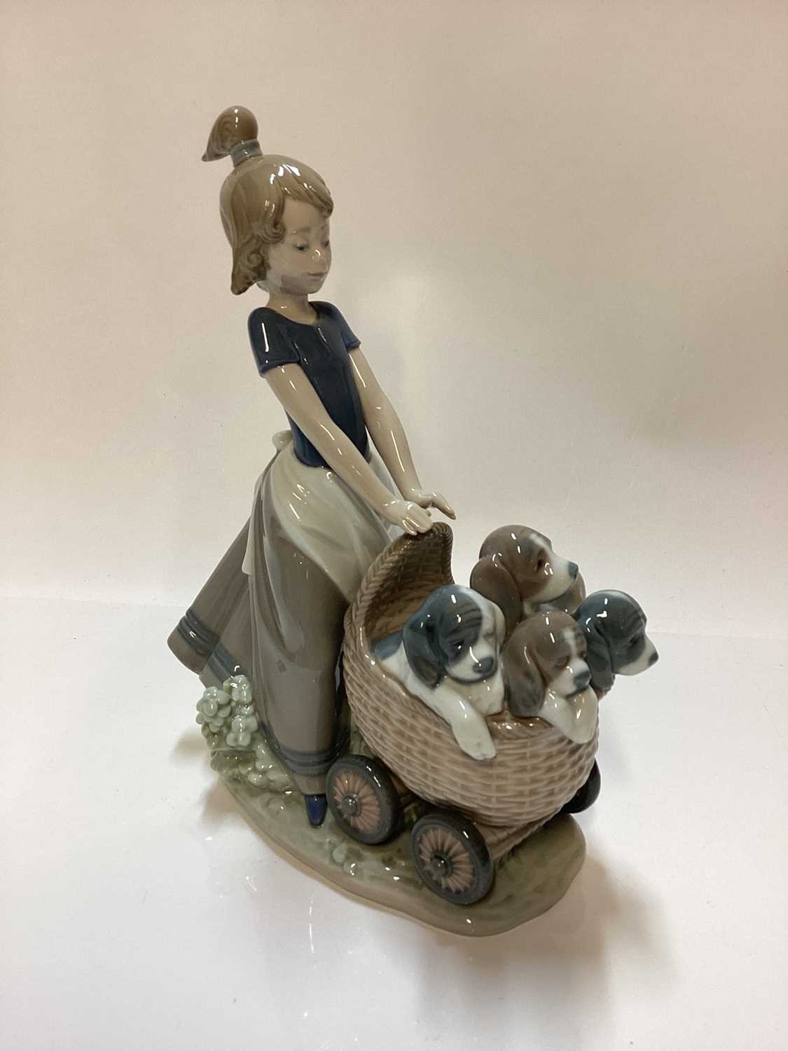Lot 1185 - Three Lladro porcelain figure groups - girl