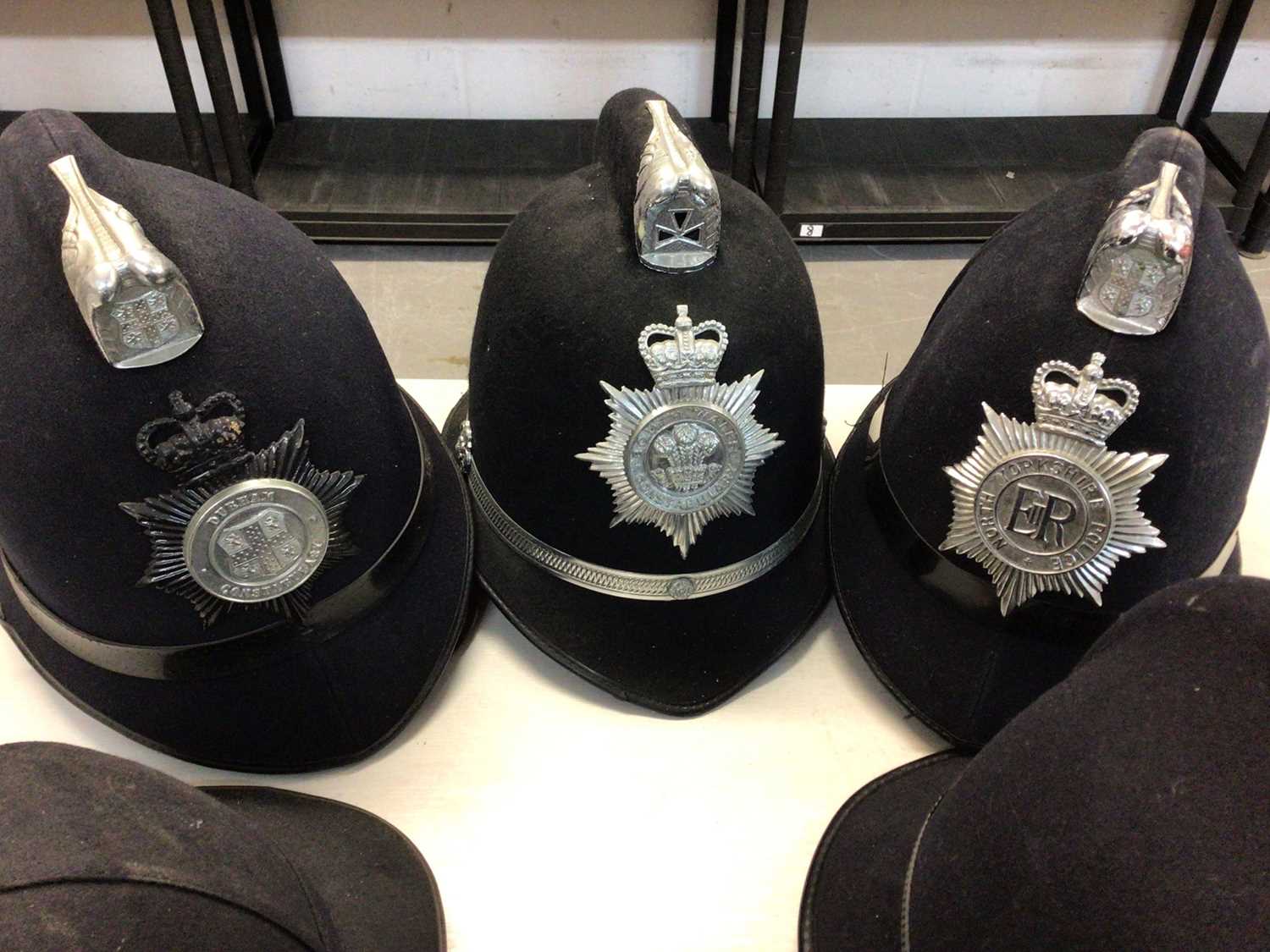 Lot 554 - Group of six Elizabeth II Police helmets for