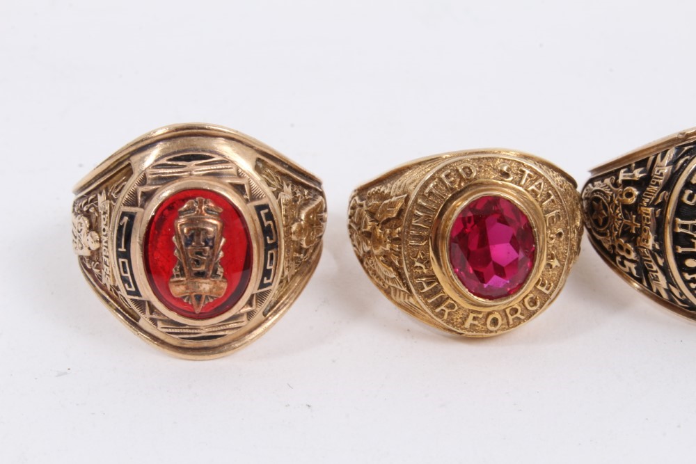 Lot 1019 - Five gold gem set college/ university rings