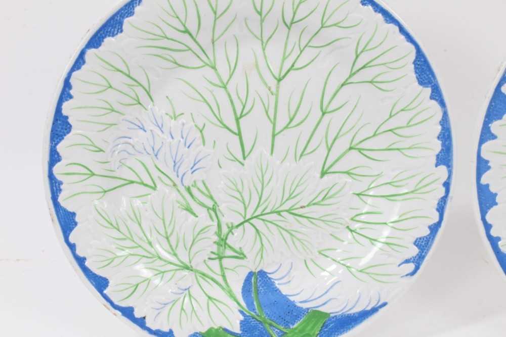Lot 90 - A pair of pearlware plates, boldly painted in