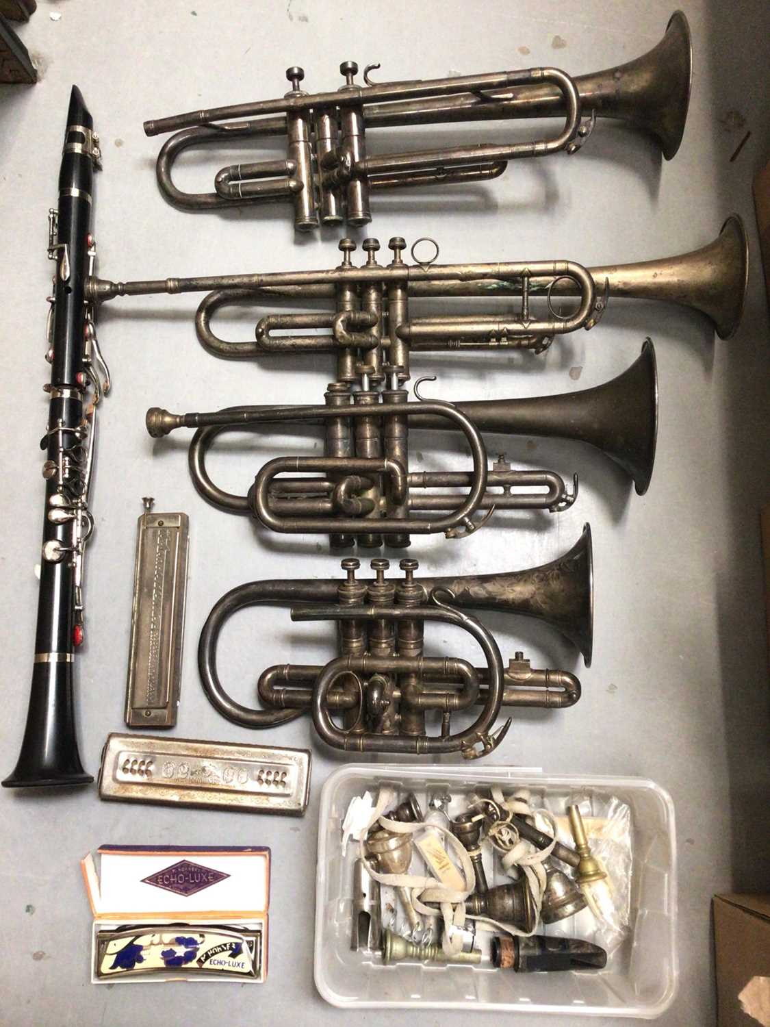 Lot 439 - Two trumpets, two hornets, a clarinet, mouth