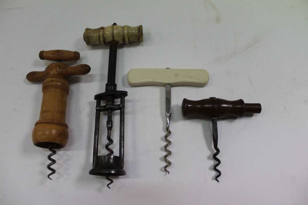 Lot 2431 - Two pillar bone and steel corkscrew and