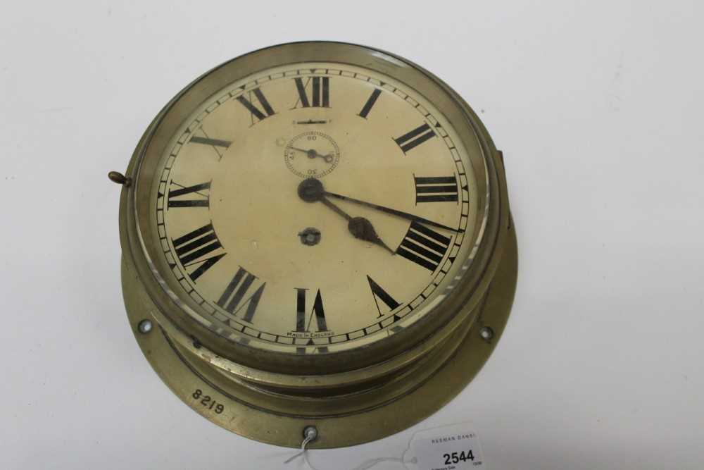Lot 2544 - A brass bulkhead clock, white enamel dial,