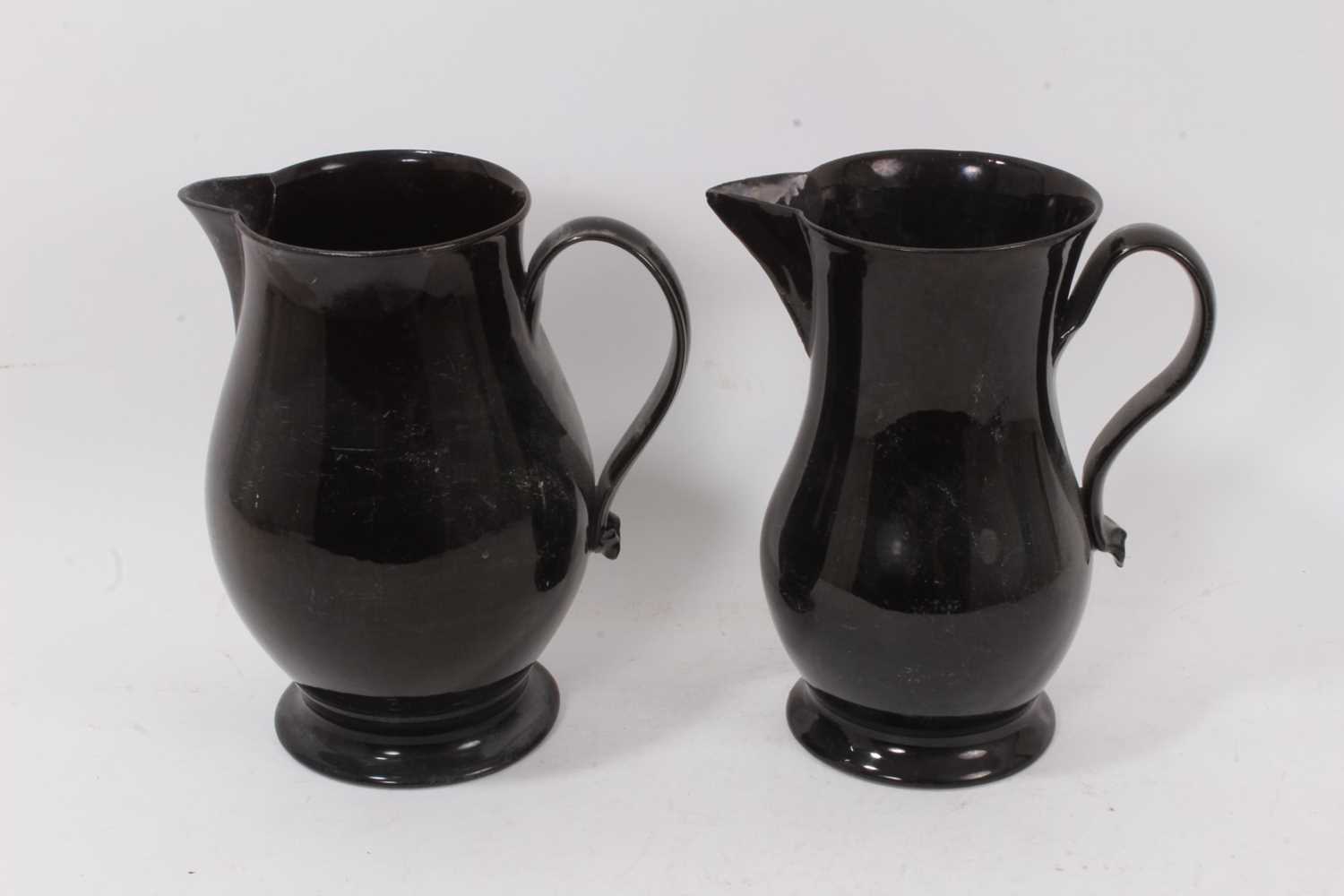 Lot 1312 - Two large 18th century jackfield jugs