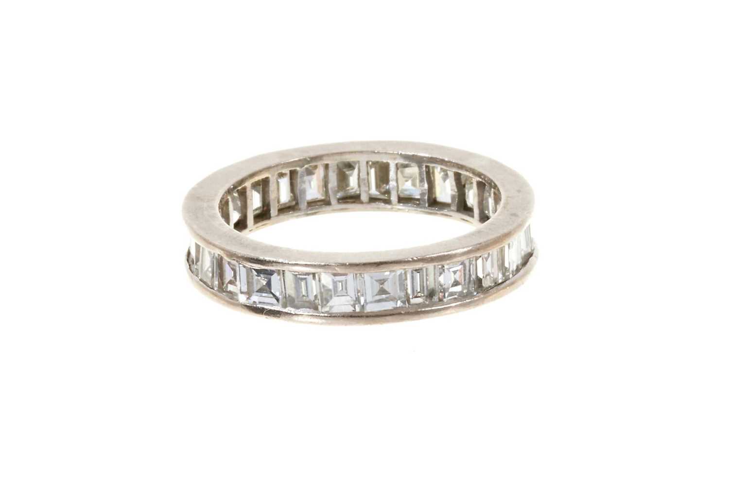 Lot 452 - Diamond full band eternity ring with step