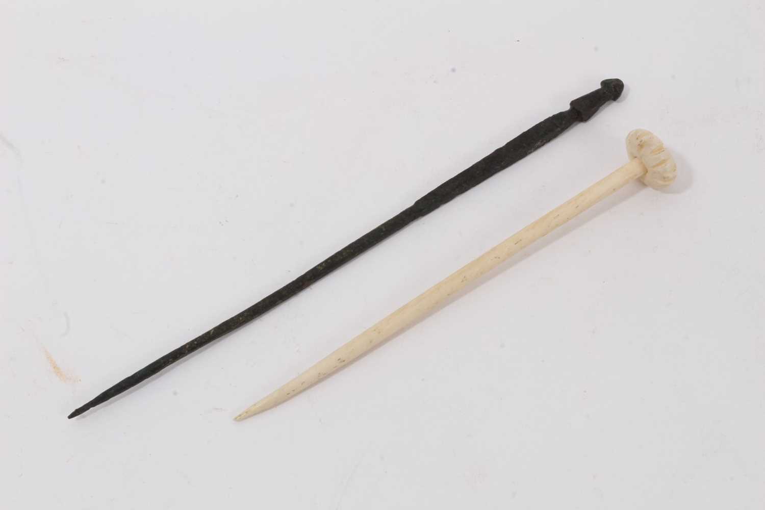 Lot 1072 - Bronze Roman pin and a Roman carved bone