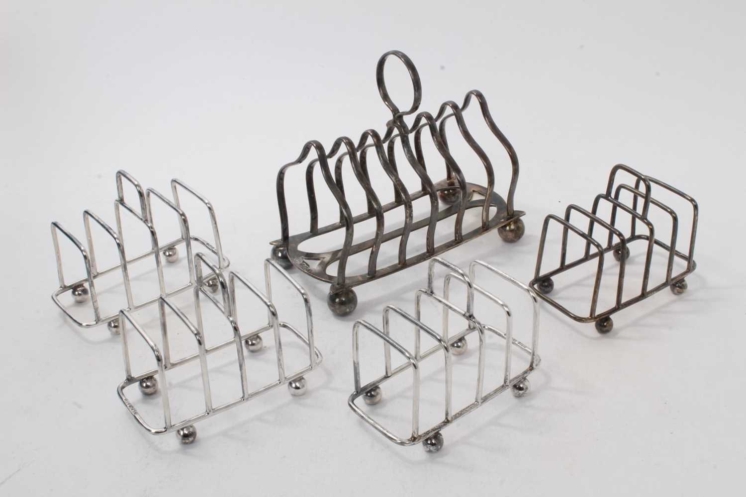 Lot 546 - Edwardian silver six division toast rack,