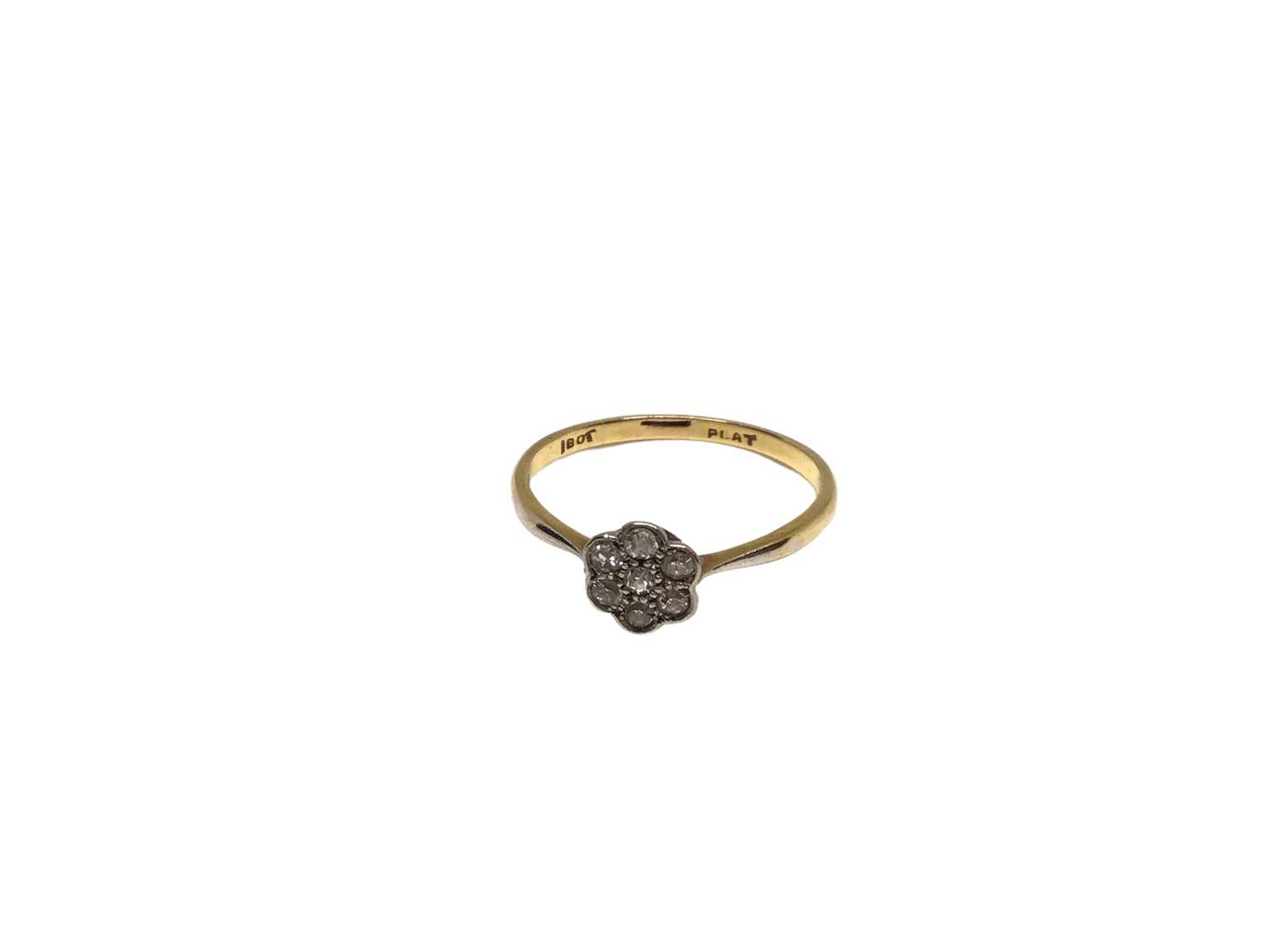 Lot 73 - 18ct gold diamond flower head ring in