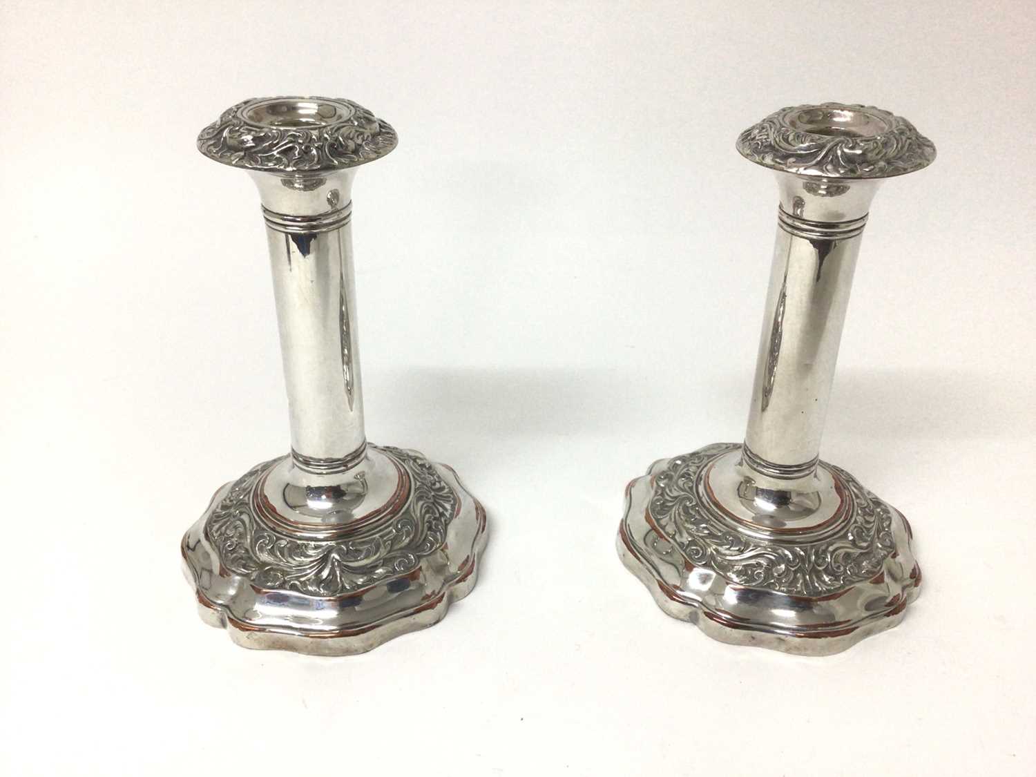 Lot 591 - Pair of Victorian silver plated candlesticks