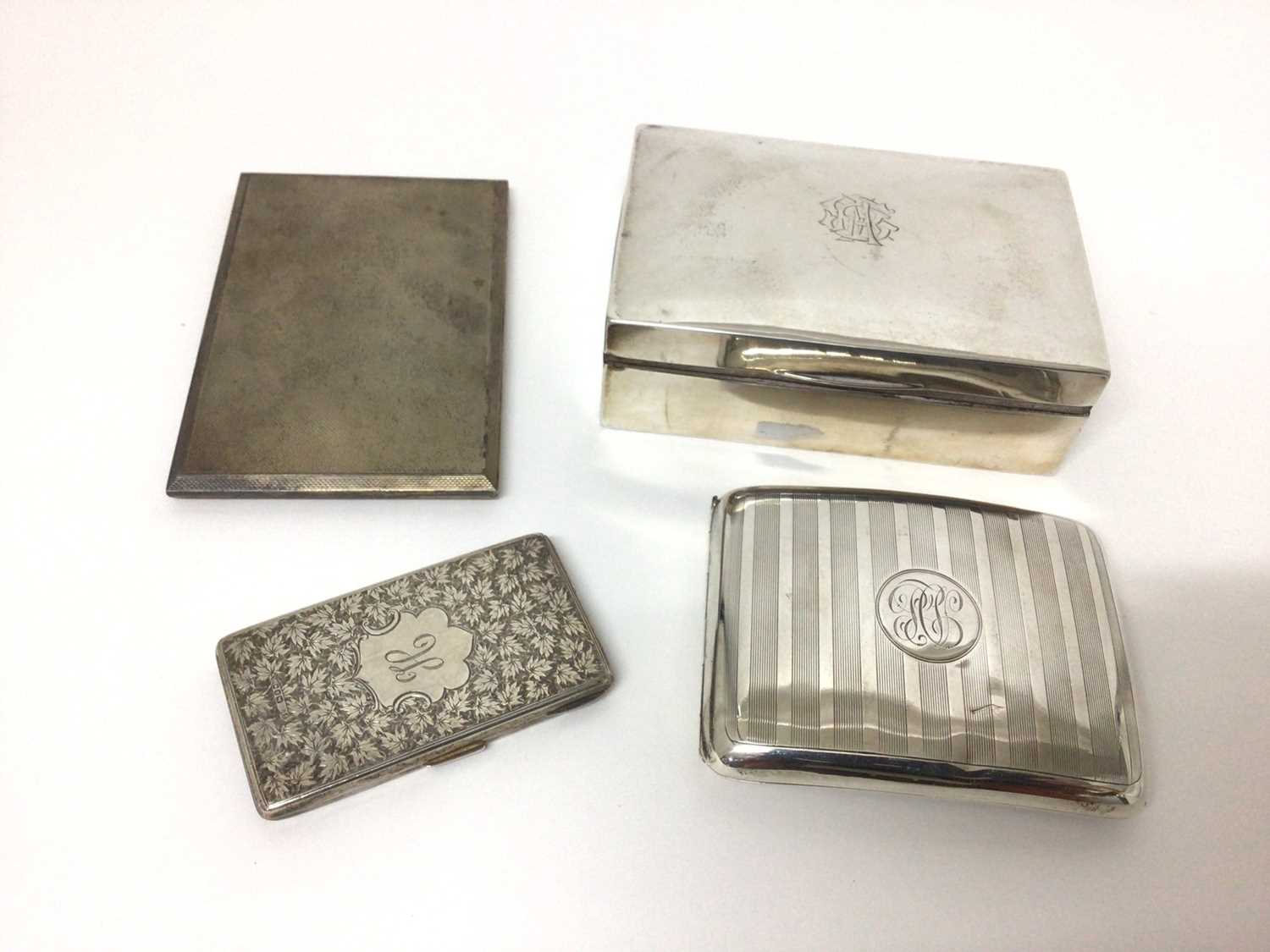 Lot 68 - Four silver cigarette cases and a silver