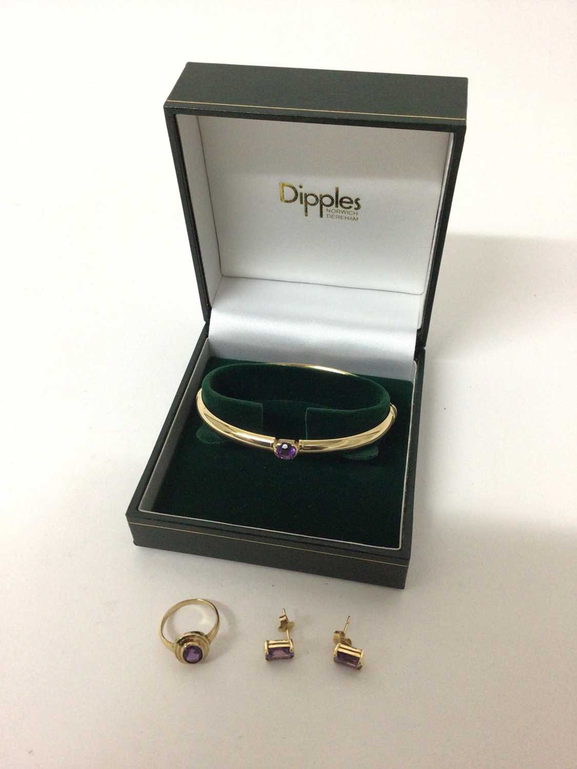 Lot 166 - 9ct gold and amethyst hinged bangle, earring