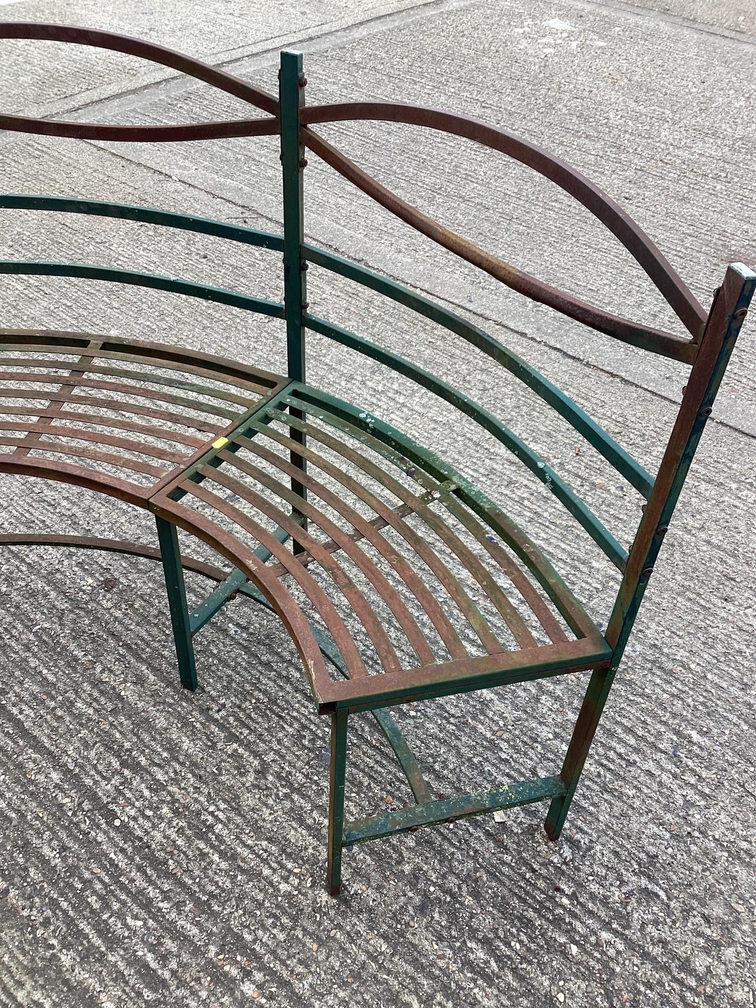 Lot 1374 - Semi-circular metal garden bench, 175cm