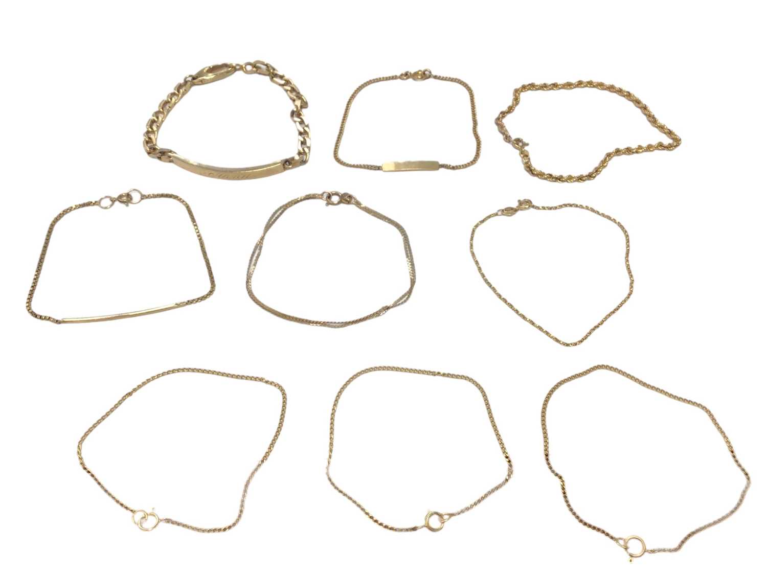 Lot 93 - Nine 9ct gold bracelets including two