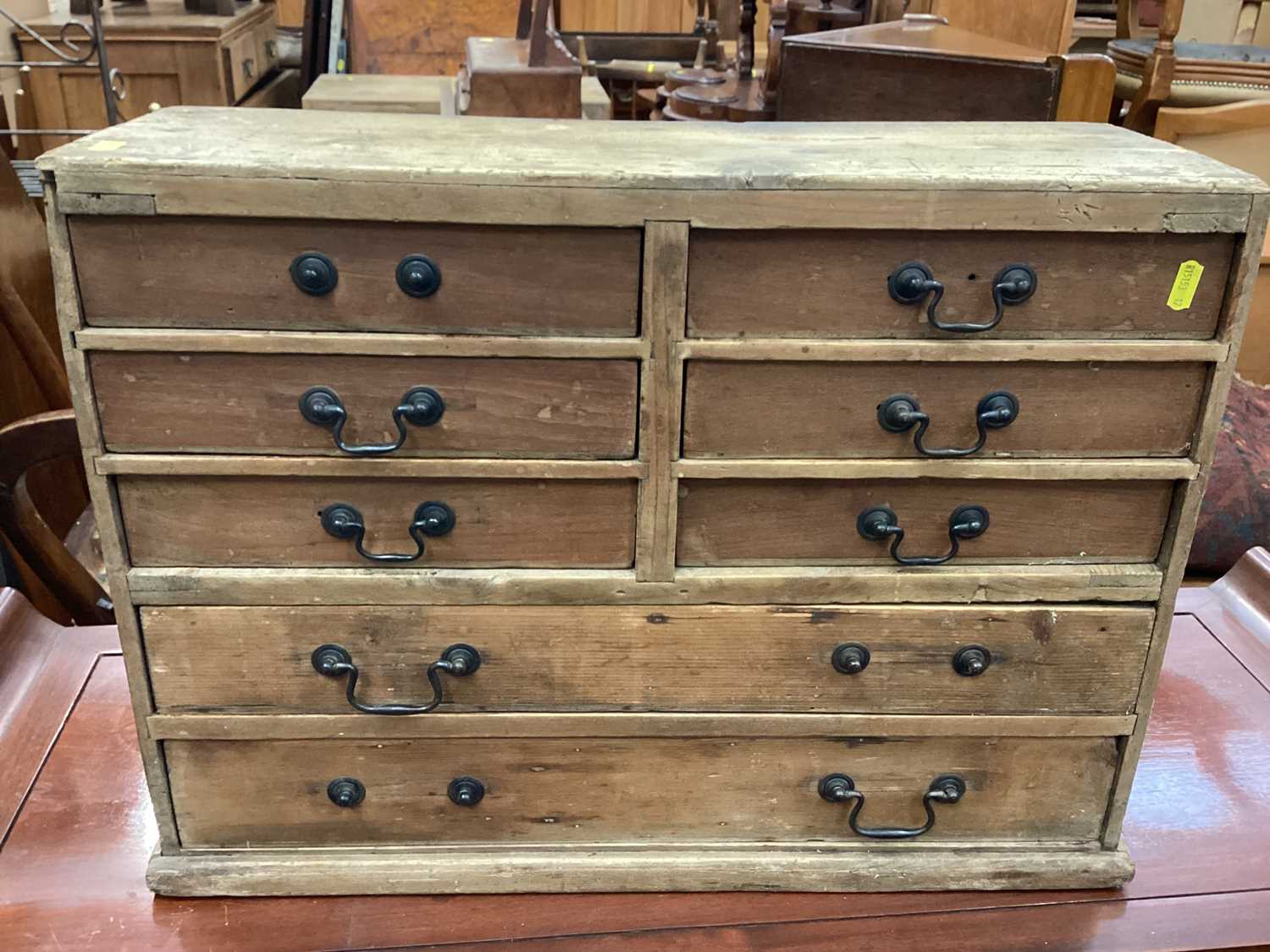 Lot 1208 - Antique pine nest of drawers with brass