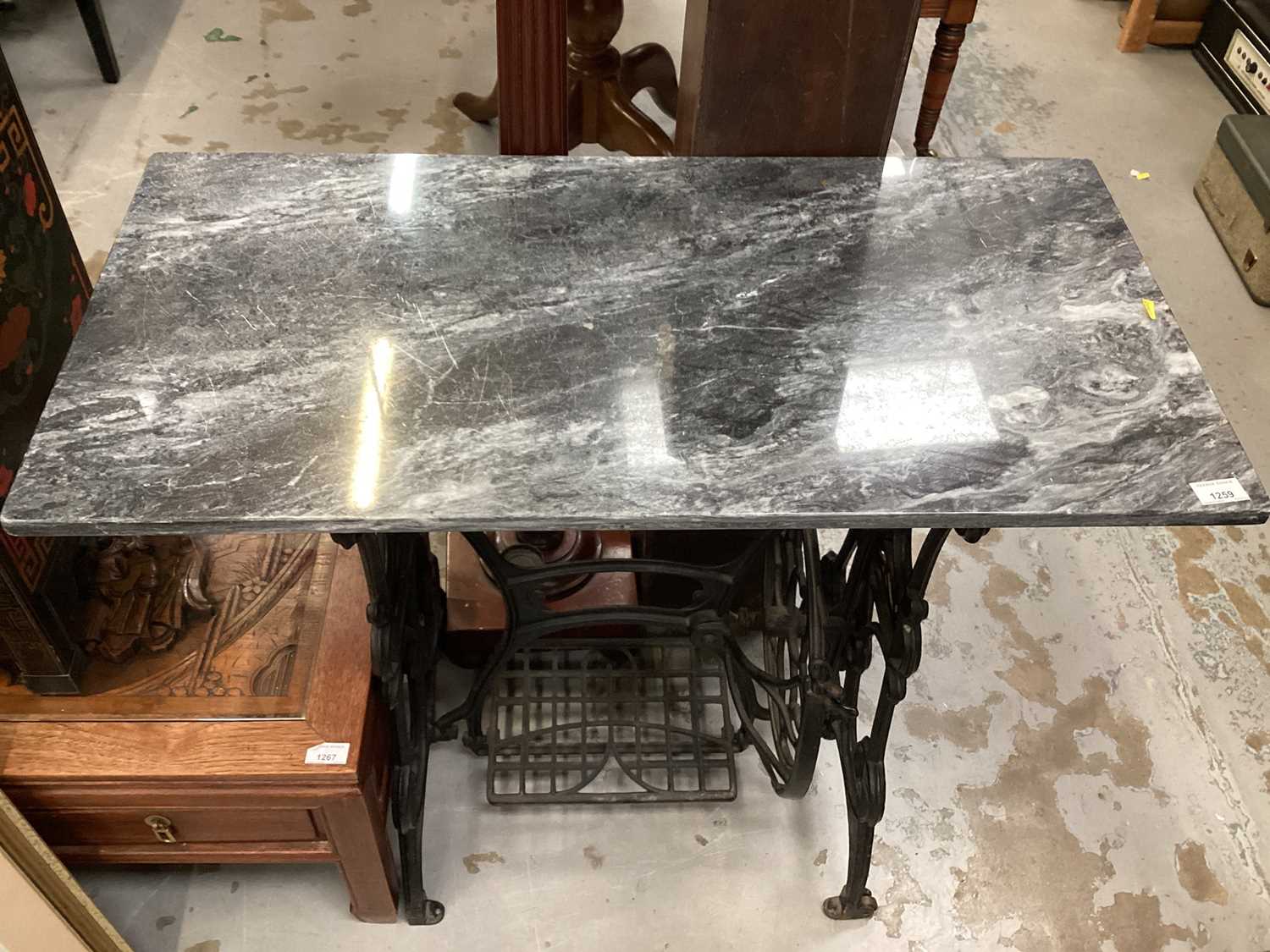 Lot 1259 - Treadle sewing machine base with marble top,