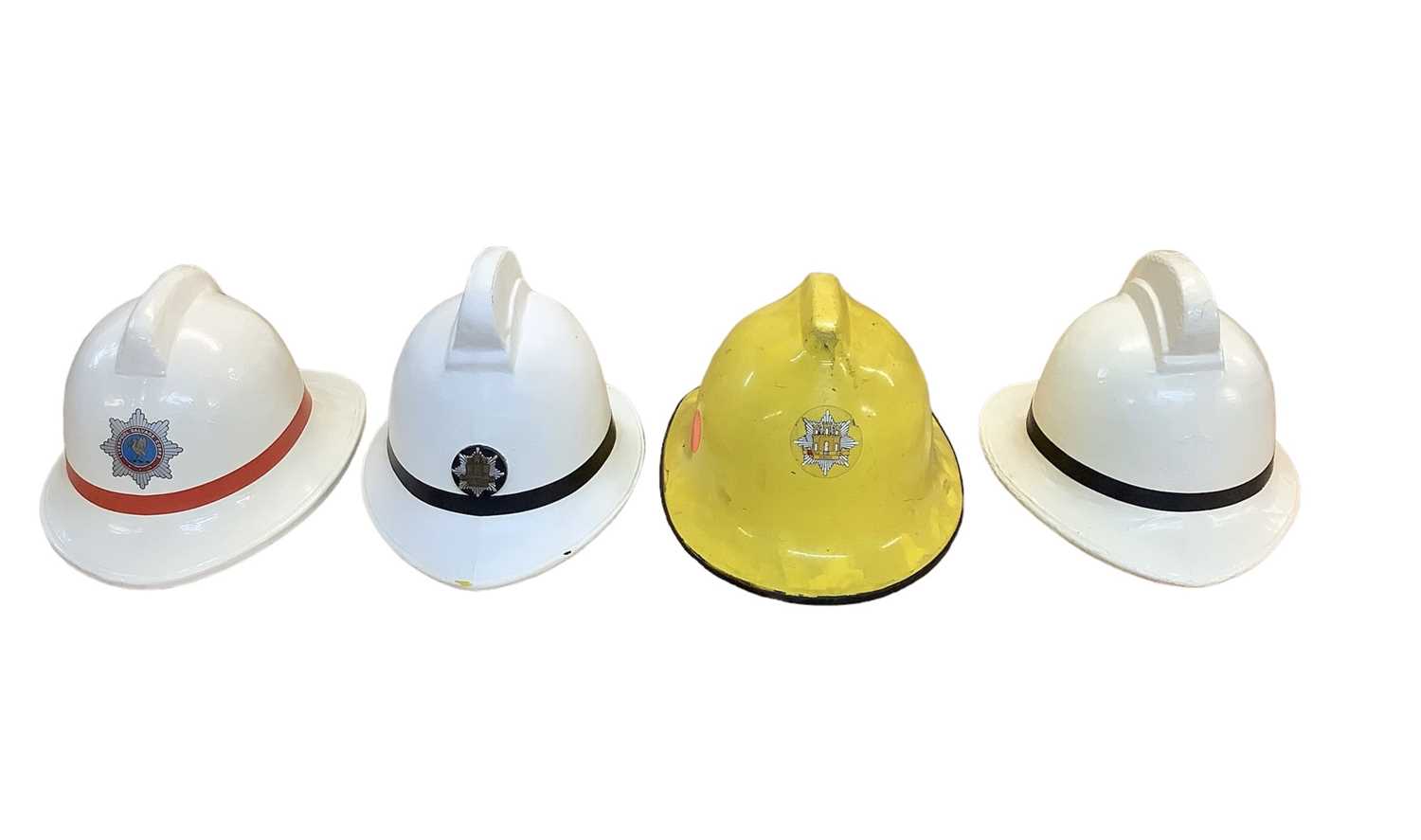 Lot 820 - Group of four Fire Brigade helmets including
