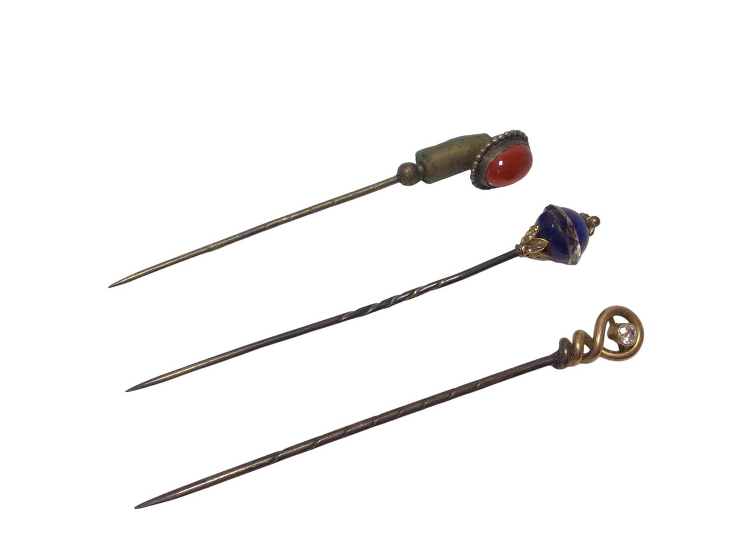 Lot 583 - Three stick pins
