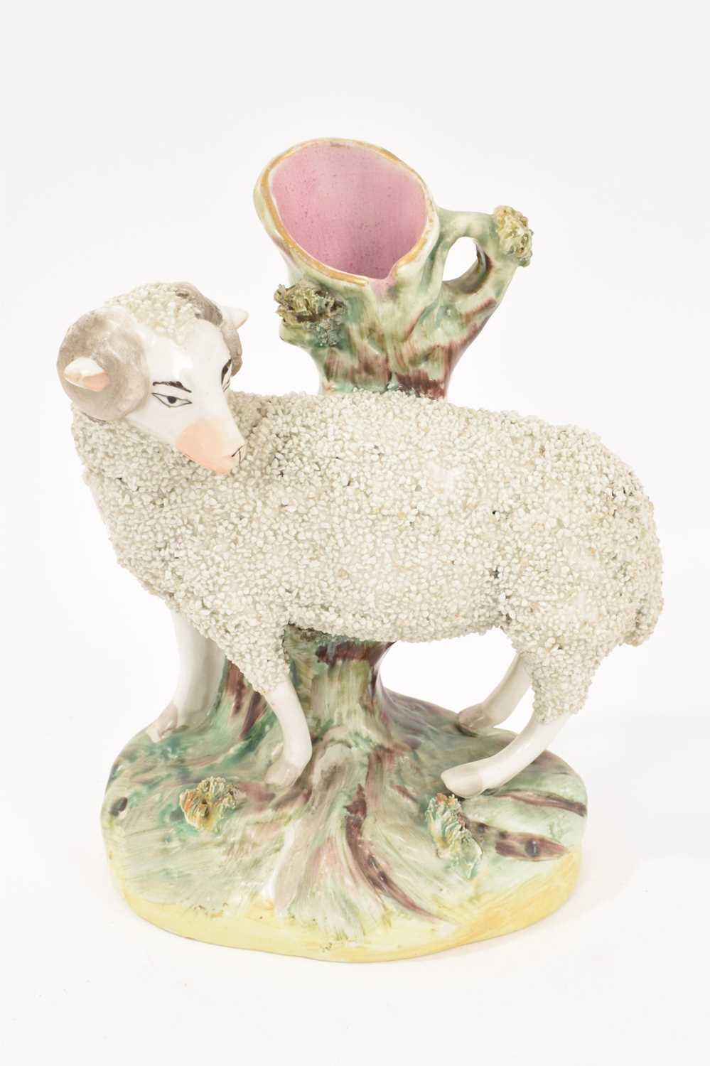 Lot 257 - Staffordshire pottery sheep spill vase