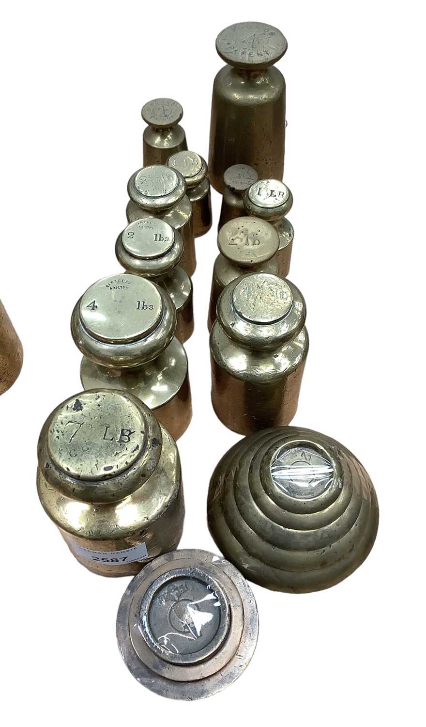 Lot 2587 - Group of antique brass weights, including