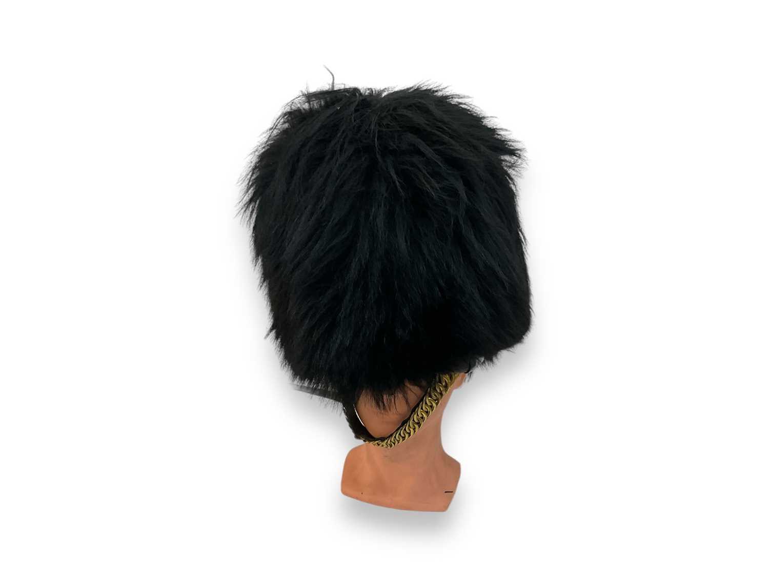 Lot 747 - 20th century bear skin hat / helmet with