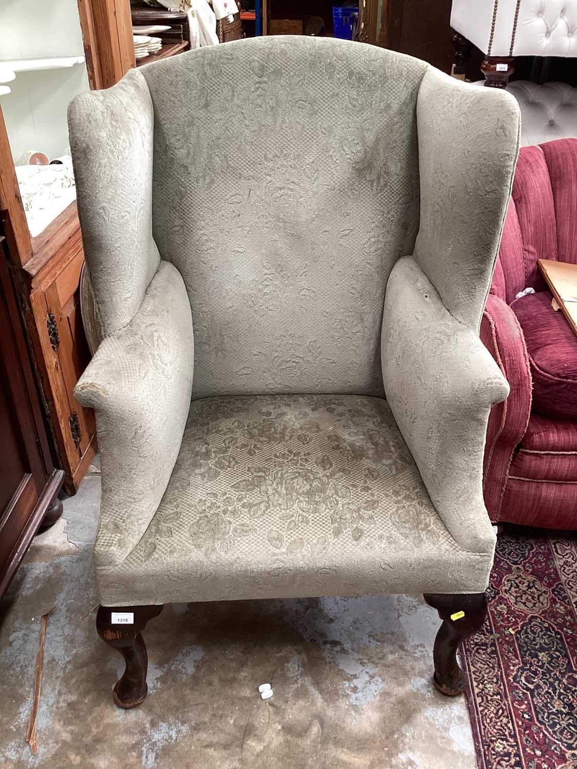 Lot 1318 - Georgian style wing back armchair with