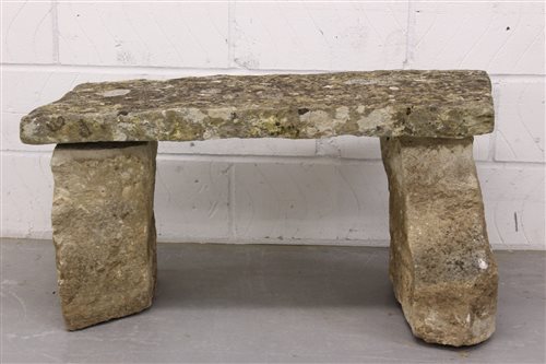 Lot 1618 - Carved stone bench, slab top on stone