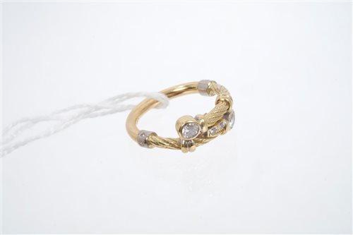 Lot 796 - Gold (18ct) torque ring with a crossover
