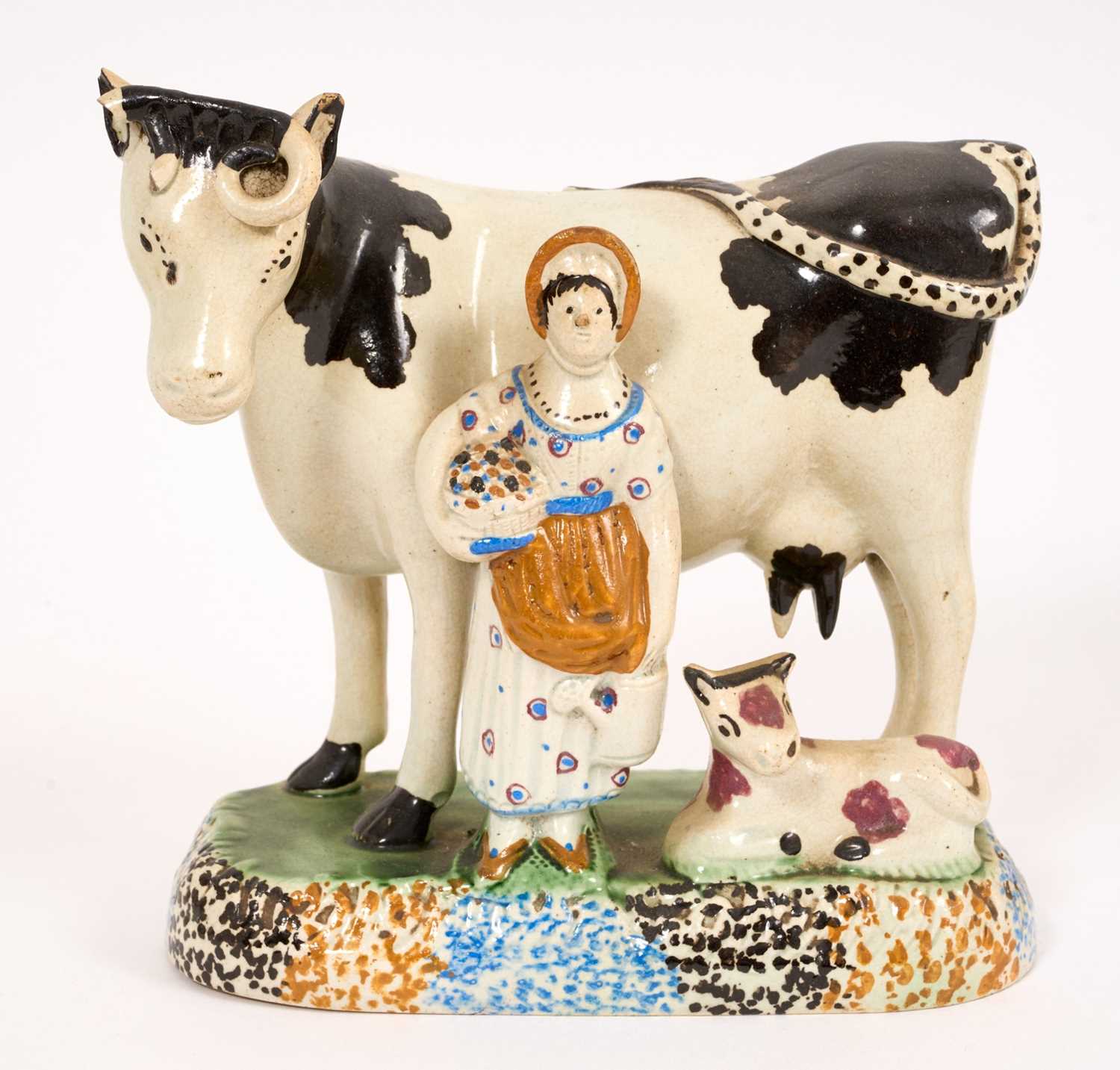 Lot 280 - Rare Yorkshire Don Pottery group of a cow,