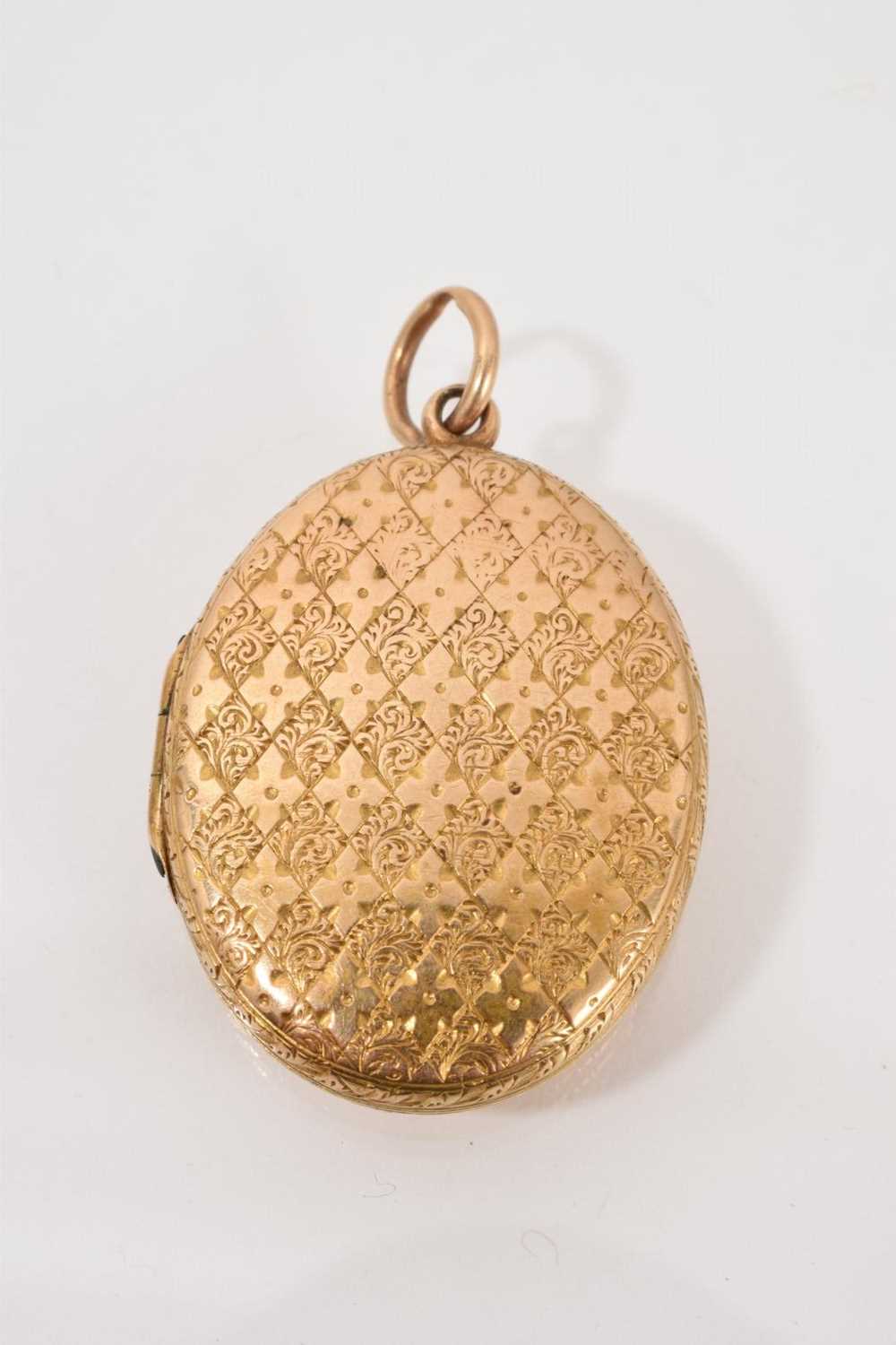Lot 651 - Victorian yellow metal oval locket with