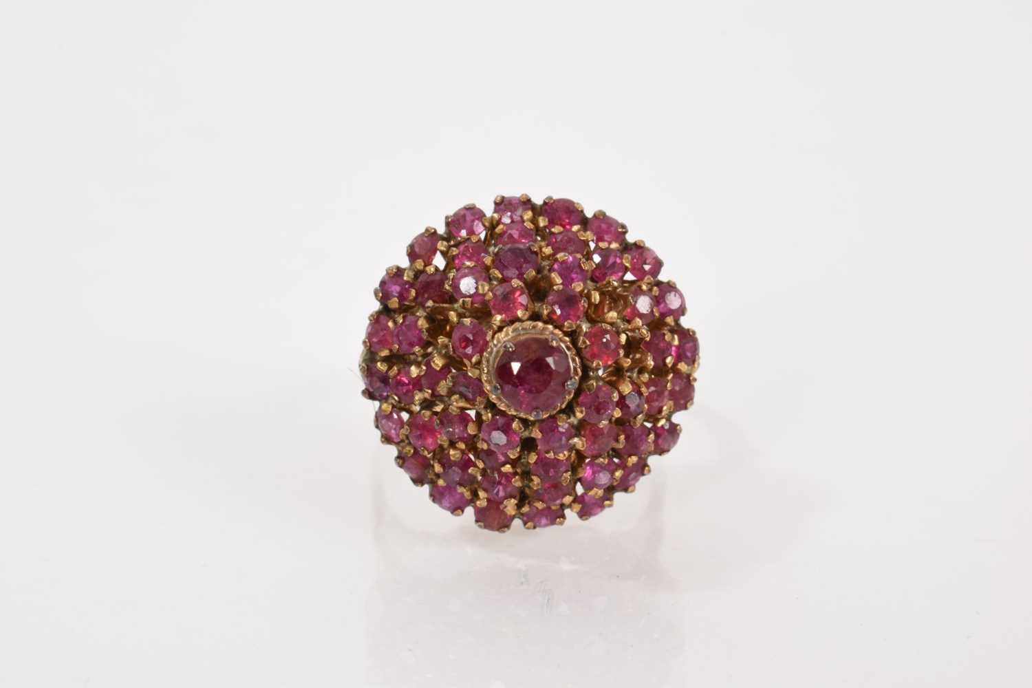 Lot 705 - Eastern ruby cluster ring in a tiered claw
